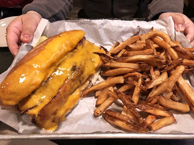 A sandwich that requires both hands and zero shame. The melted cheese hugs that brisket like it's saying, "I've got you, buddy."