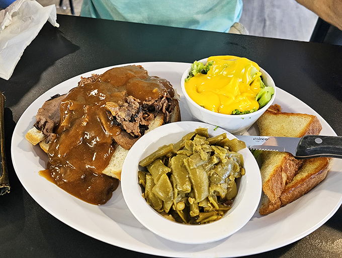 The holy trinity of comfort food: perfectly tender roast beef, seasoned green beans, and Texas toast&mdash;with gravy connecting it all like a delicious conductor.