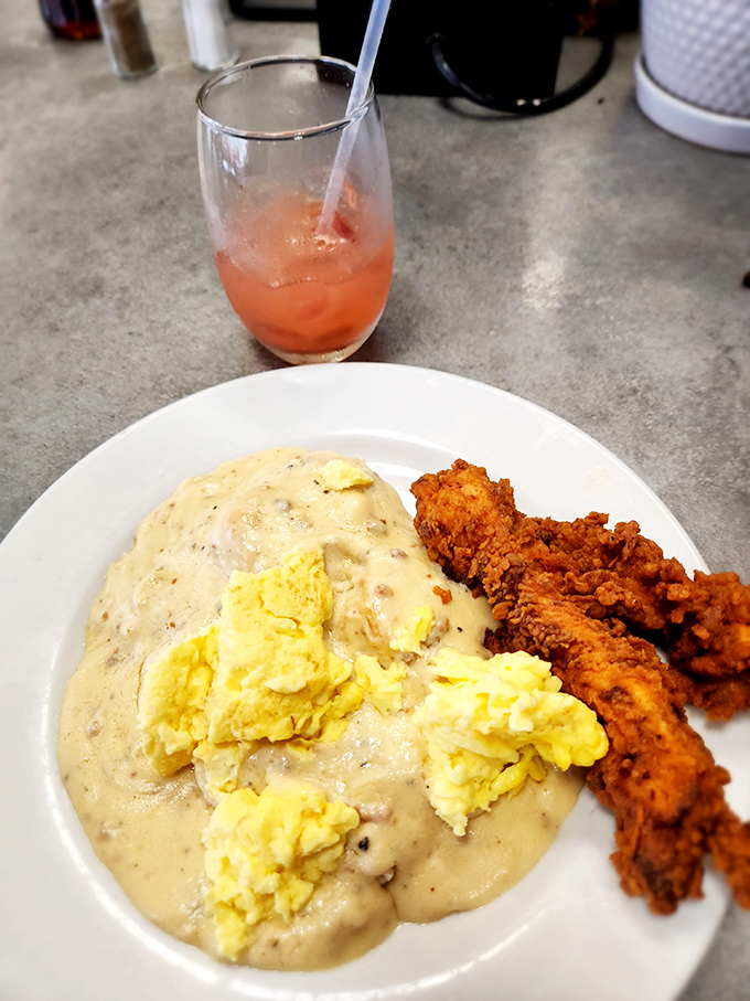 When biscuits and gravy meet perfectly fried chicken, magic happens. This plate doesn't just feed your body—it hugs your soul from the inside.