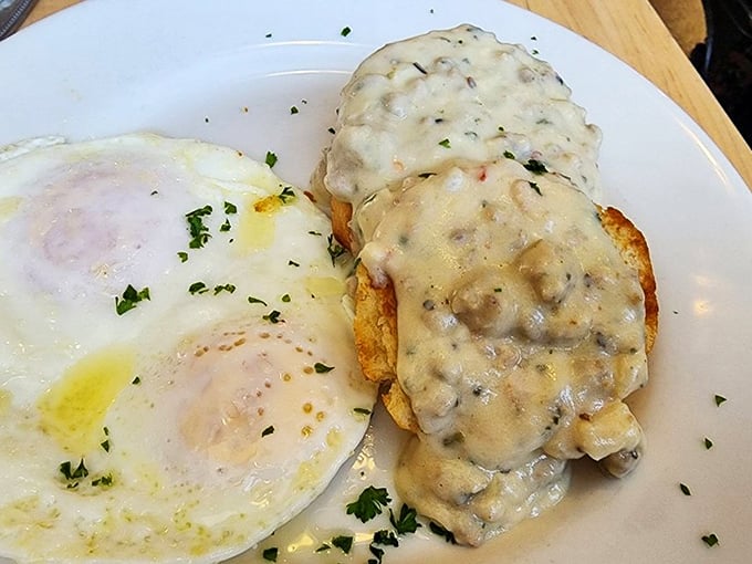 Southern comfort in its purest form&mdash;creamy gravy blankets a golden biscuit while perfectly cooked eggs stand by, ready for their moment of glory.