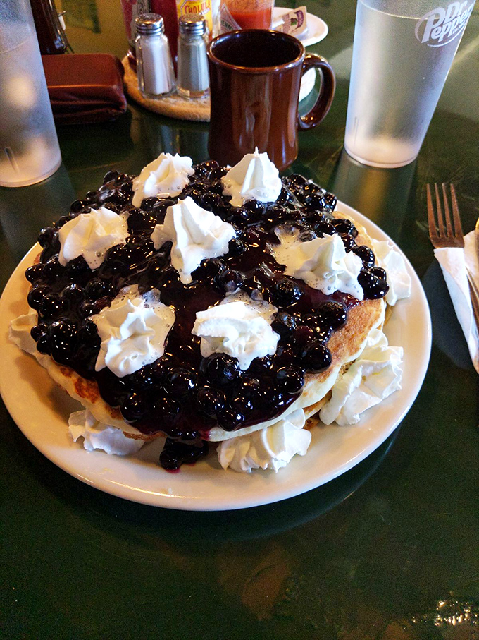 This isn't just a blueberry pancake&mdash;it's a monument to excess, where whipped cream islands float in a sea of blueberry bliss. Diet starts tomorrow!