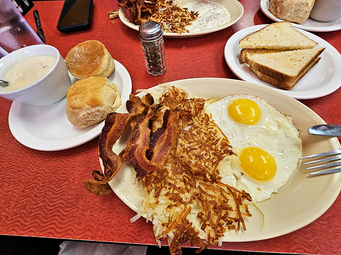 Sunny-side up eggs, crispy hash browns, and bacon that means business. This plate doesn't need Instagram filters&mdash;it's authentic diner perfection.