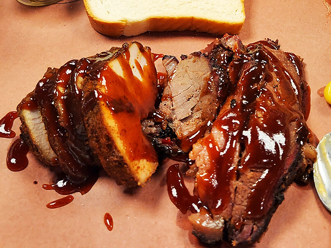When sauce cascades over brisket like this, it's not just a meal &ndash; it's edible performance art that belongs in the Louvre of lunch.