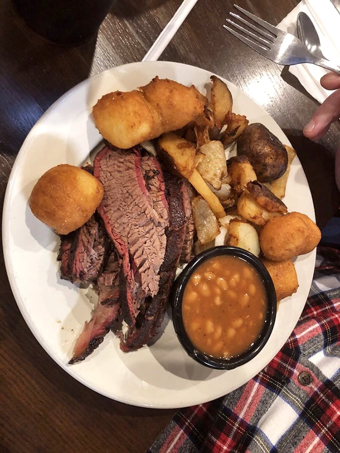 Brisket so perfectly smoked it makes you wonder if you should send a thank-you note to the cow. Those hush puppies aren't staying quiet for long.