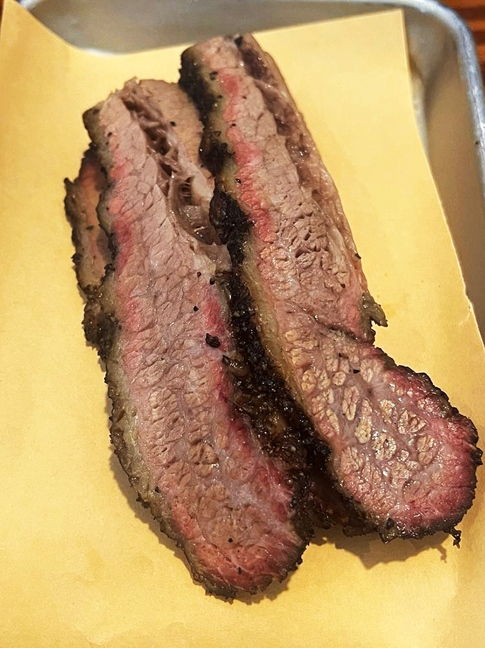 The close-up that launches a thousand cravings. That pink smoke ring isn't just pretty – it's the PhD diploma of proper barbecue technique.