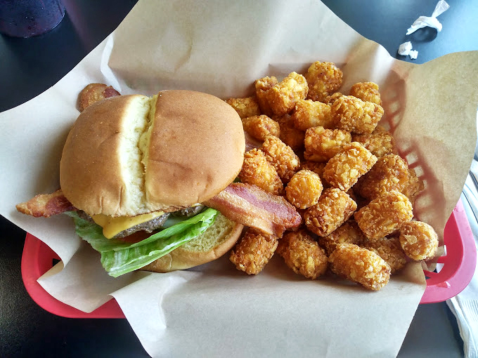 This isn't just a burger &ndash; it's a masterclass in comfort, served with a side of crispy tater tots that whisper, "Diet? What diet?"