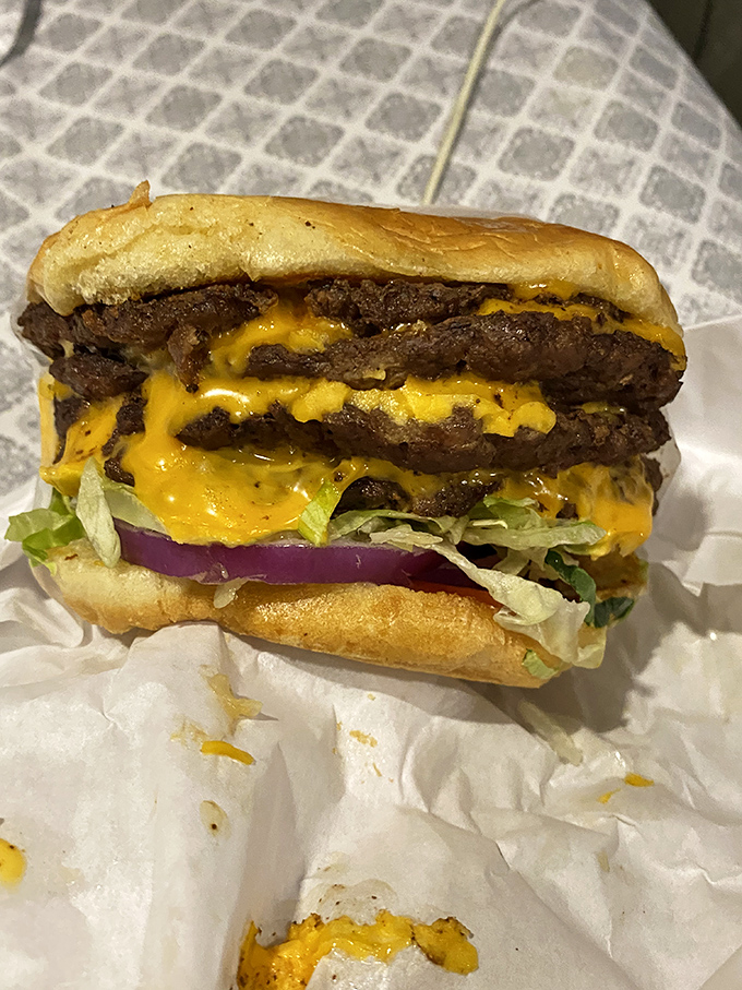 Layer upon layer of seasoned beef and melted cheese&mdash;this isn't just a burger, it's a geological event millions of years in the making.