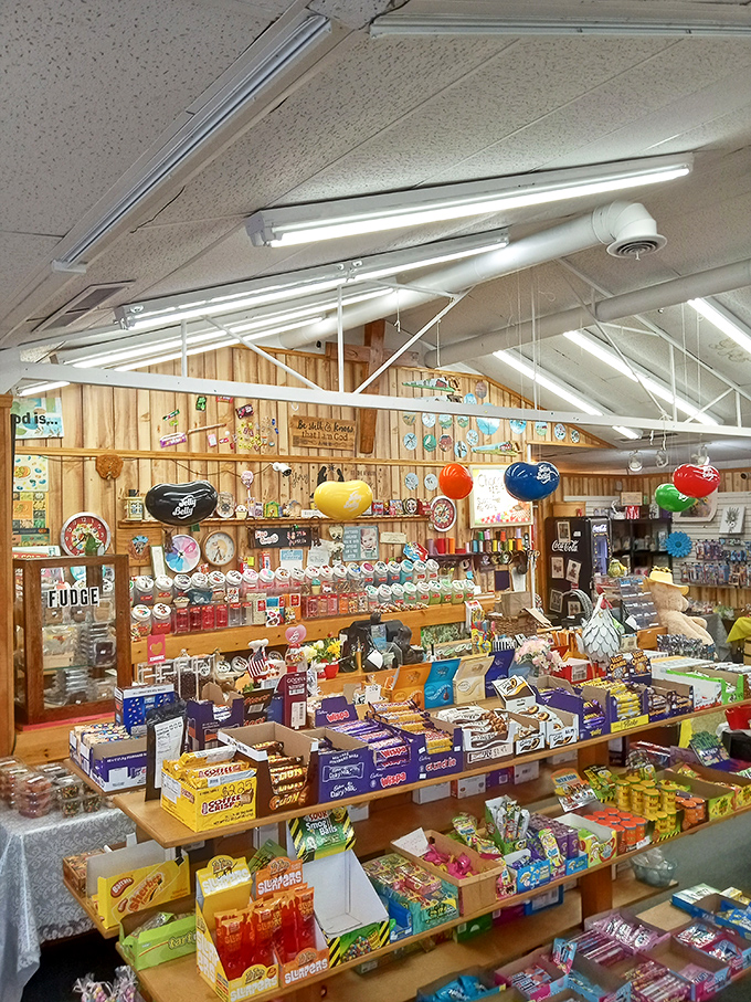Giant Jelly Beans hang from the ceiling like sweet planets in a sugar galaxy, watching over their smaller counterparts below.