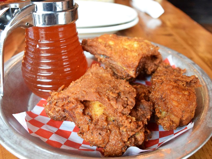 The holy trinity: perfectly fried chicken, checkered paper, and that magical amber honey. Some relationships are just meant to be.