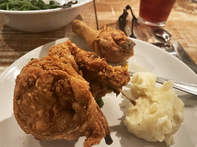 The holy trinity of comfort food: perfectly fried chicken, cloud-like mashed potatoes, and green beans that actually taste like vegetables should.