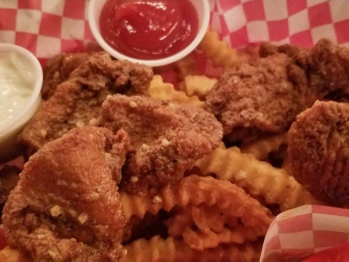 Golden-fried chicken strips that would make your grandmother both jealous and proud, served with zero pretension and maximum flavor.