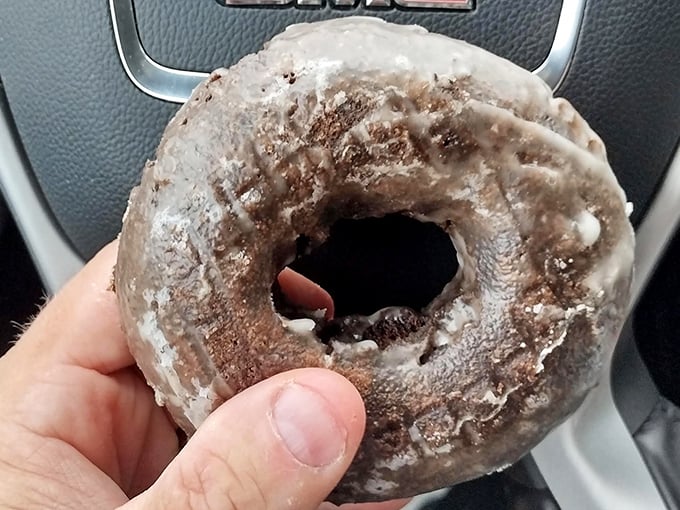 The chocolate glazed donut in its natural habitat &ndash; the car dashboard. Where many a breakfast meeting has been inadvertently accessorized with telltale powdered sugar.