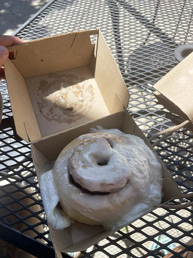 The perfect spiral, glistening with frosting, awaits its destiny. This is the Mona Lisa of cinnamon rolls&mdash;mysterious, alluring, and impossible to stop staring at.