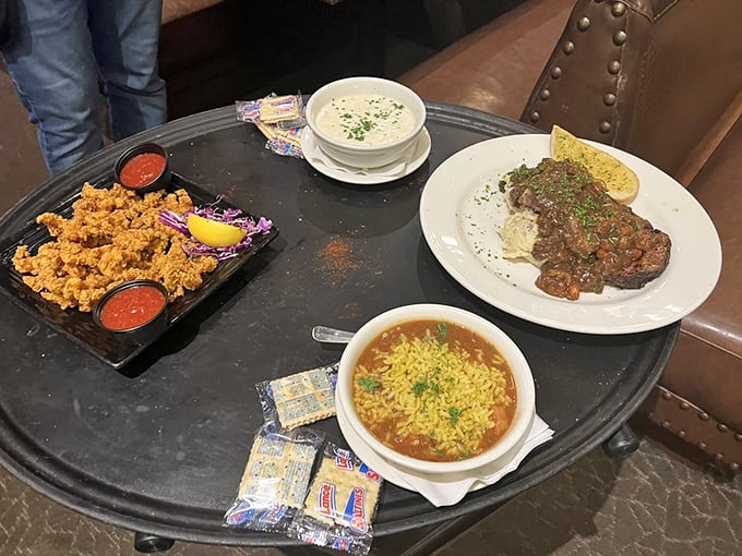 A table spread that tells a delicious story: crispy fried treasures, hearty gumbo, and something smothered in gravy that's calling my name.