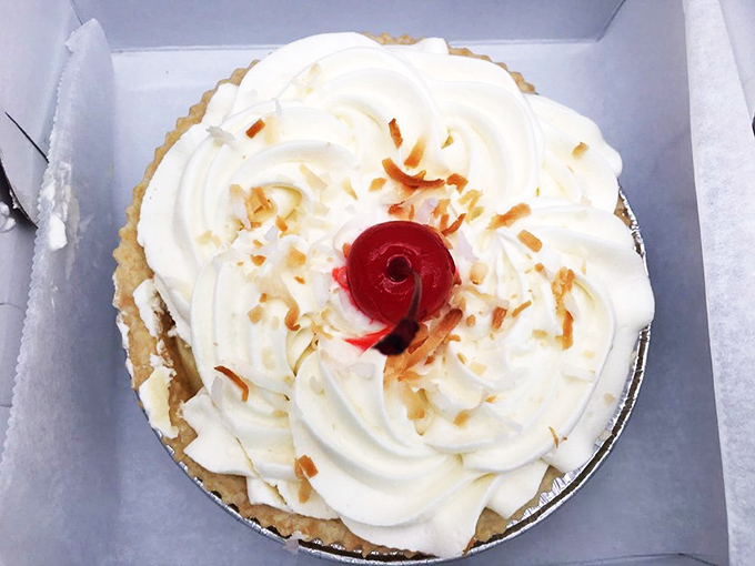 A coconut cream masterpiece topped with toasted coconut flakes and a cherry that's not just along for the ride. This pie doesn't need Instagram filters.