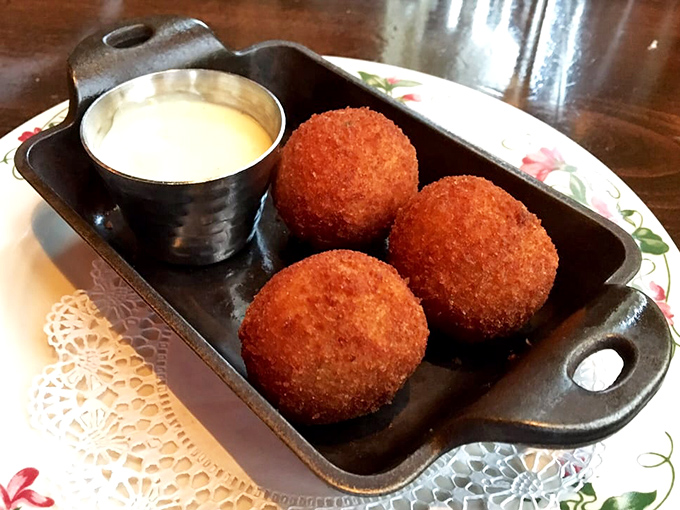 These golden-brown crab cakes aren't just appetizers&mdash;they're little crispy ambassadors of the sea, perfectly accompanied by a creamy dipping sauce that demands to be savored.