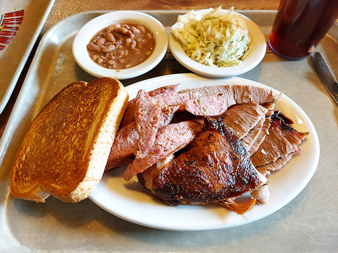 The holy trinity of barbecue&mdash;perfectly sliced meats, golden Texas toast, and sides that don't know they're supposed to be supporting actors.