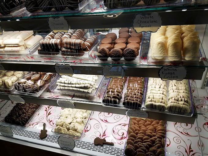 A glass case of temptation that makes museum displays look boring. Each piece is edible art waiting for its moment.