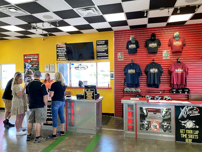 Racing memorabilia adorns the walls as eager drivers queue up, already rehearsing excuses for why they'll be a tenth slower than their friends.