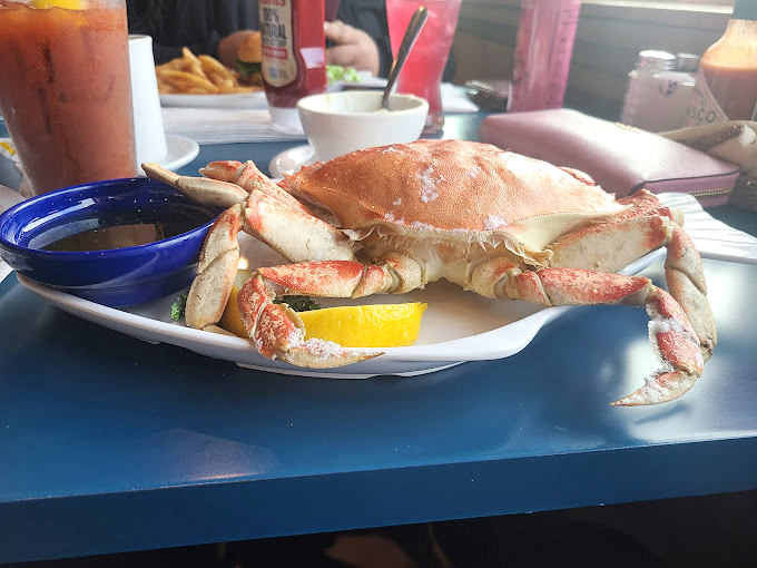 This crab sandwich isn't just lunch&mdash;it's a Pacific Northwest handshake, complete with sweet meat and a lemon wedge for that perfect zing.