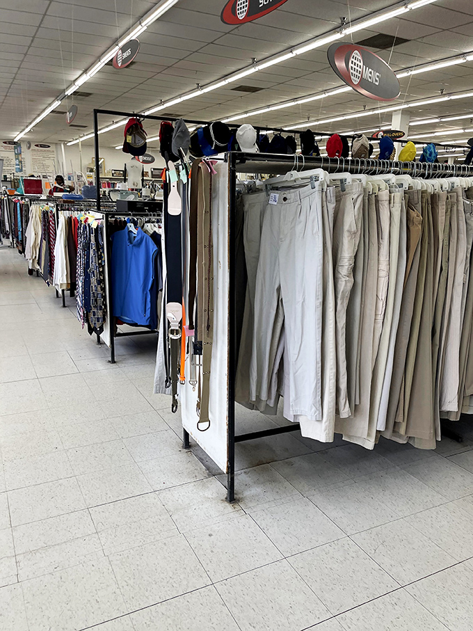 Men's pants hang with military precision, a neutral-toned battalion ready to march into someone's wardrobe revolution.