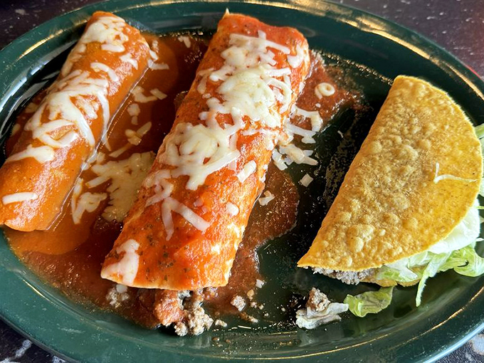 A holy trinity of Mexican cuisine: enchilada, burrito, and taco. The sauce-to-cheese ratio here would make a mathematician weep with joy.