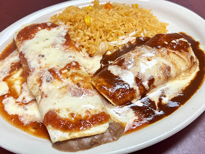 These enchiladas aren't just covered in sauce and cheese&mdash;they're swimming in flavor, with that golden rice standing by like a loyal sidekick.