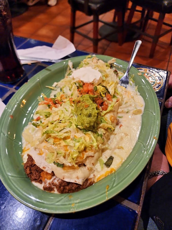 Heaven on a plate: A loaded enchilada crowned with fresh toppings and melted cheese that stretches like the Mississippi is wide.