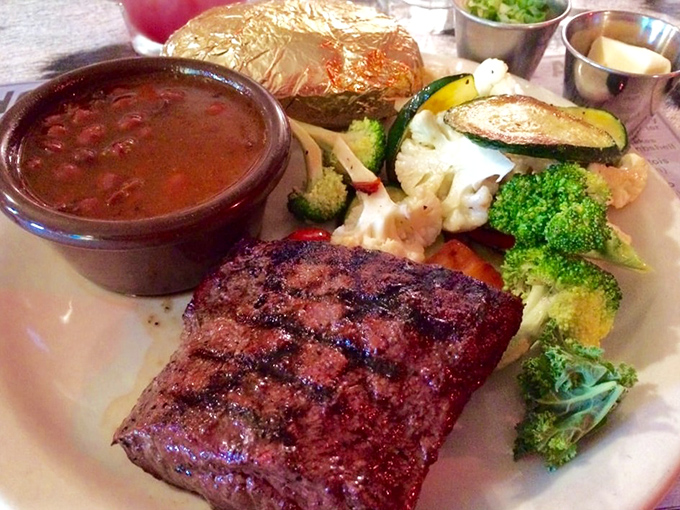 This flat iron steak with its perfect grill marks isn't just dinner&mdash;it's edible artwork with a side of vegetables playing supporting roles.