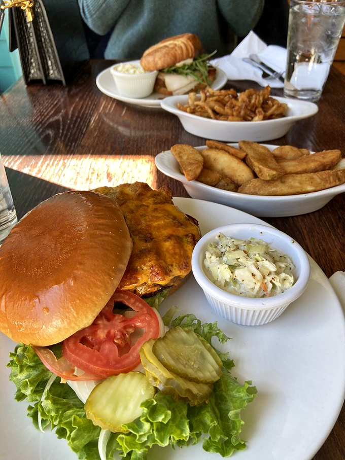 This isn't just a burger – it's an edible masterpiece with perfect pickle-to-cheese ratio, accompanied by golden potato wedges that demand to be savored.