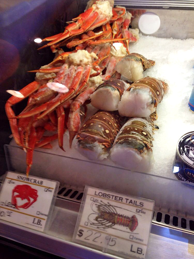 The seafood market display case&mdash;where lobsters and snow crabs await their destiny. It's like a beauty pageant where everyone's a winner.