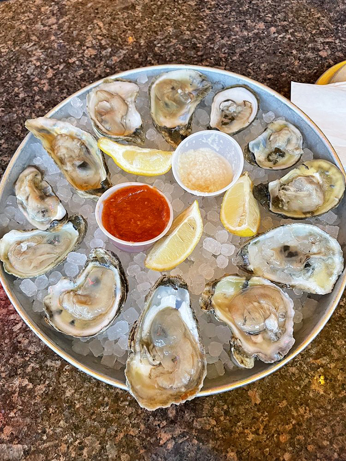 Ocean-fresh oysters served with the essentials: lemon for brightness, sauce for kick, and the promise that Missouri can indeed master maritime cuisine.