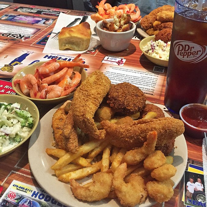 The holy trinity of Southern comfort: perfectly fried catfish, golden shrimp, and crispy fries, with Dr. Pepper standing by for moral support.