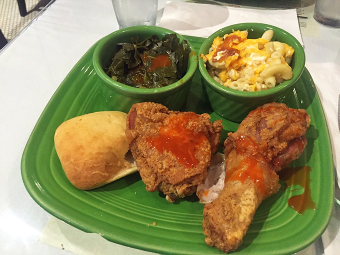 A symphony in green: collards singing bass notes, mac and cheese hitting the high notes, and fried chicken conducting the whole delicious orchestra.