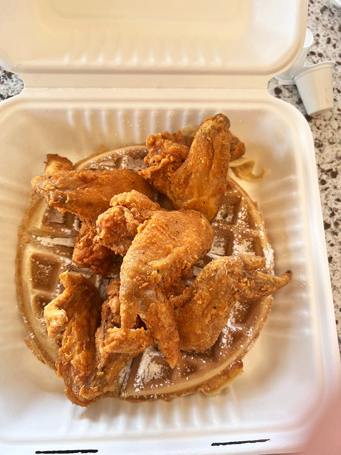 The classic duo that proves opposites attract: crispy, savory wings nestled atop a golden waffle. It's breakfast and dinner having a delicious affair.