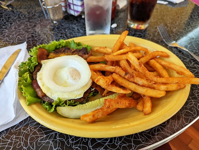 Who says breakfast can't include fries? This open-faced sandwich with a sunny-side-up egg is brunch rebellion at its finest.