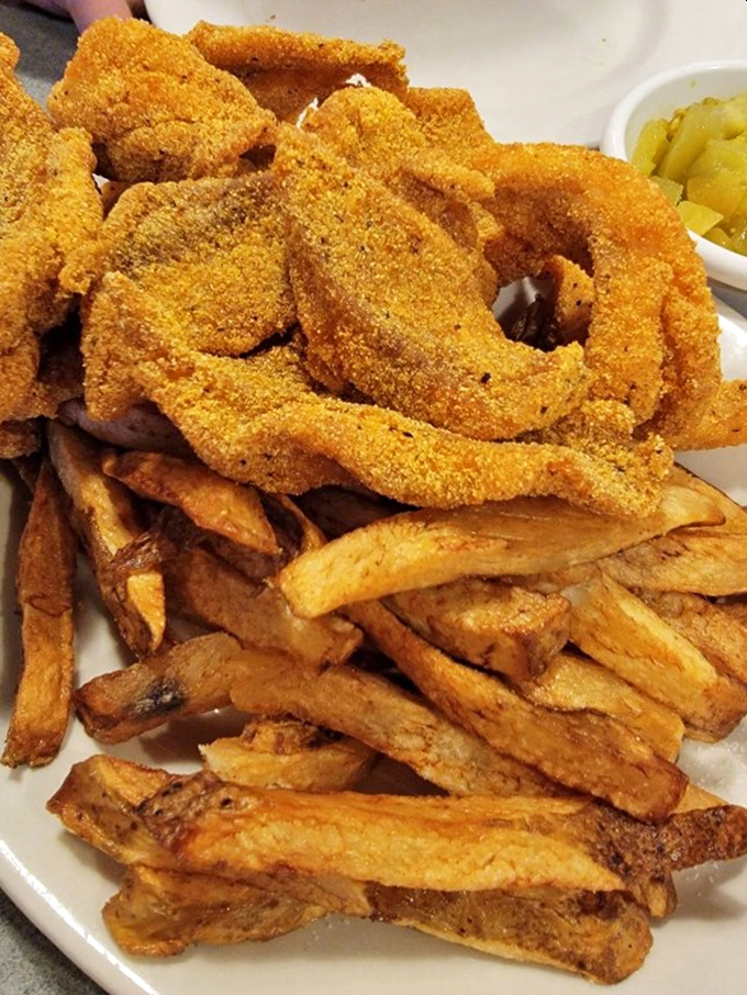 These aren't just fries; they're supporting actors deserving their own Oscar, perfectly complementing the star catfish with their crispy-outside, fluffy-inside perfection.