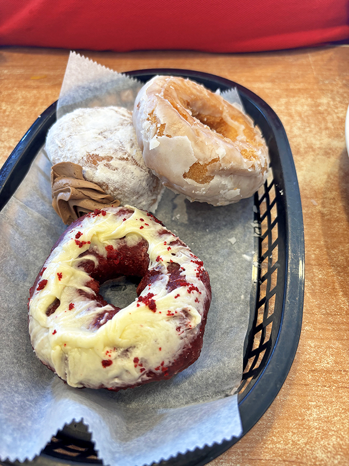 Red velvet, glazed, and powdered companions waiting for their coffee soulmates. Some relationships are just meant to be.