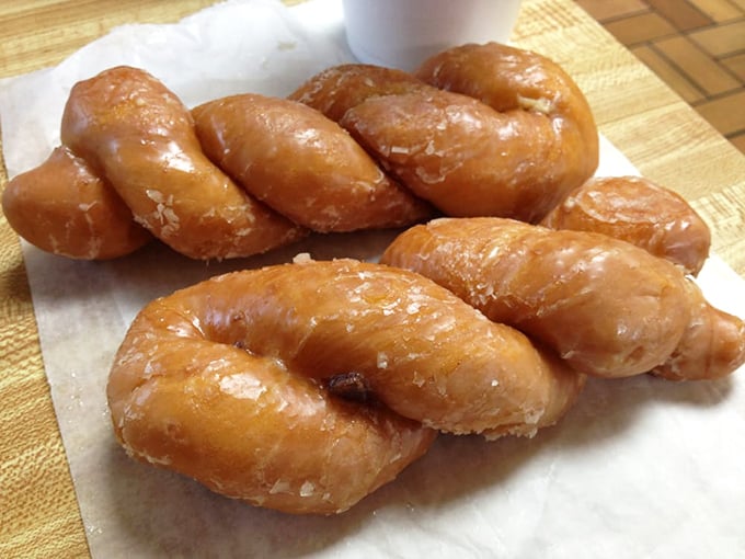 The twisted glazed donuts look like they're doing synchronized swimming in sugar. Olympic gold medal for deliciousness!