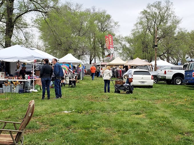 The market unfolds across the Kansas countryside like a living tapestry, where shoppers meander between tents in search of that perfect find.