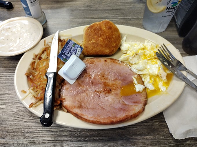 Country ham takes center stage in this breakfast drama, with perfectly cooked eggs and hash browns playing worthy supporting roles.