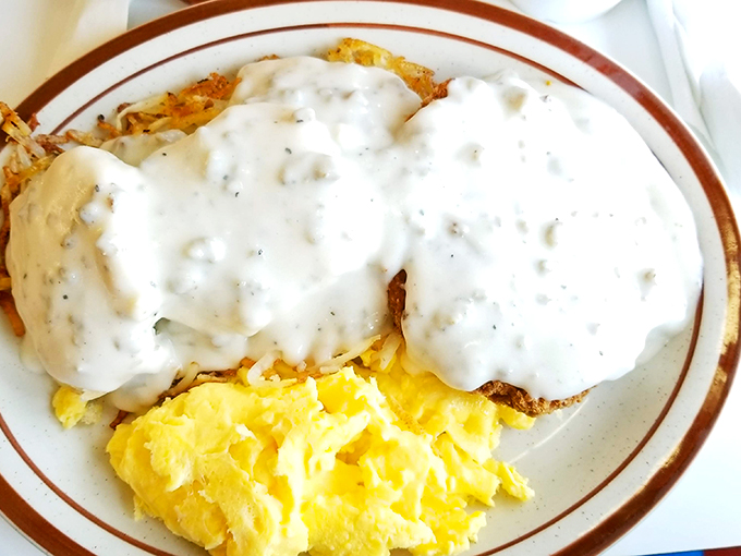 Comfort on a plate&mdash;hash browns crisped to perfection, smothered in creamy gravy, with sunny eggs standing by for moral support.