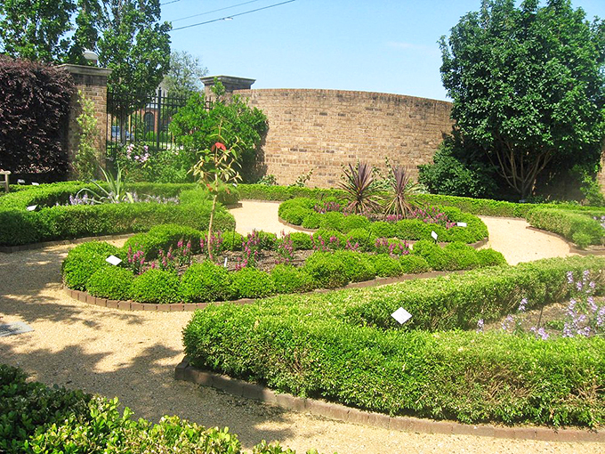 Precision-cut boxwood hedges frame garden beds like nature's version of a fancy picture frame&mdash;geometry class never looked this good.