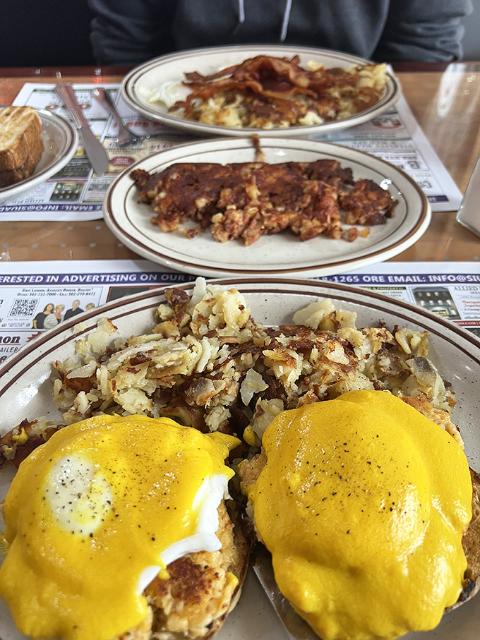 Eggs Benedict gets the Route 40 treatment with those legendary home fries stealing the spotlight. Yellow hollandaise cascades like sunshine over perfectly poached eggs.