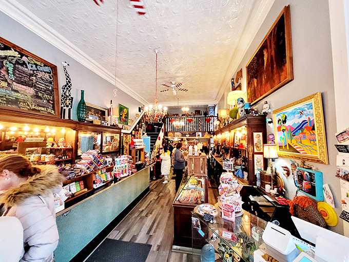 The bustling interior reveals McCord's dual identity: part candy wonderland, part community gathering spot, where locals exchange news while waiting for their chocolate fix.