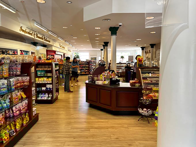 The elegant columns and warm wood tones create a sophisticated backdrop for what is, essentially, a socially acceptable adult candy spree.