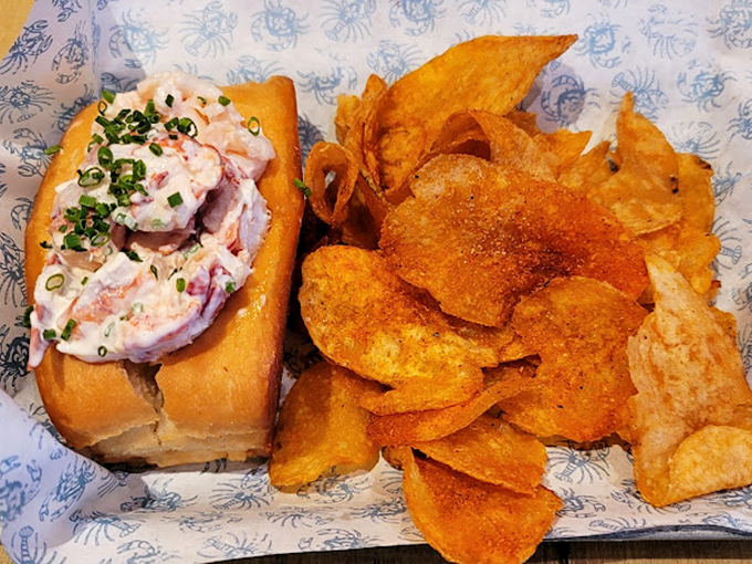 Maine meets Midwest in this picture-perfect lobster roll &ndash; chunky sweet meat nestled in buttery bread with house-made chips that crackle like autumn leaves.