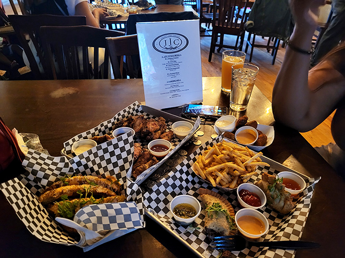 Baskets overflowing with wings, fries, and dipping sauces – the fuel needed for marathon gaming sessions and heated trash talk.