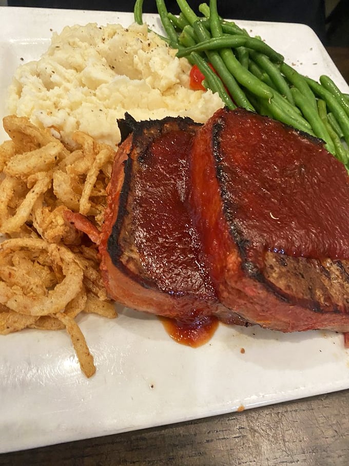 This isn't your mother's meatloaf (sorry, Mom) &ndash; it's a caramelized masterpiece with crispy edges and a savory-sweet glaze that haunts dreams.