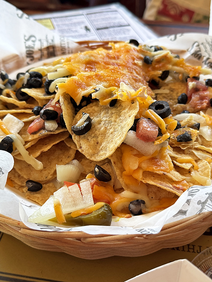 These nachos aren't just a snack&mdash;they're an architectural achievement of cheese, olives, and jalape&ntilde;os that would make Frank Gehry jealous.
